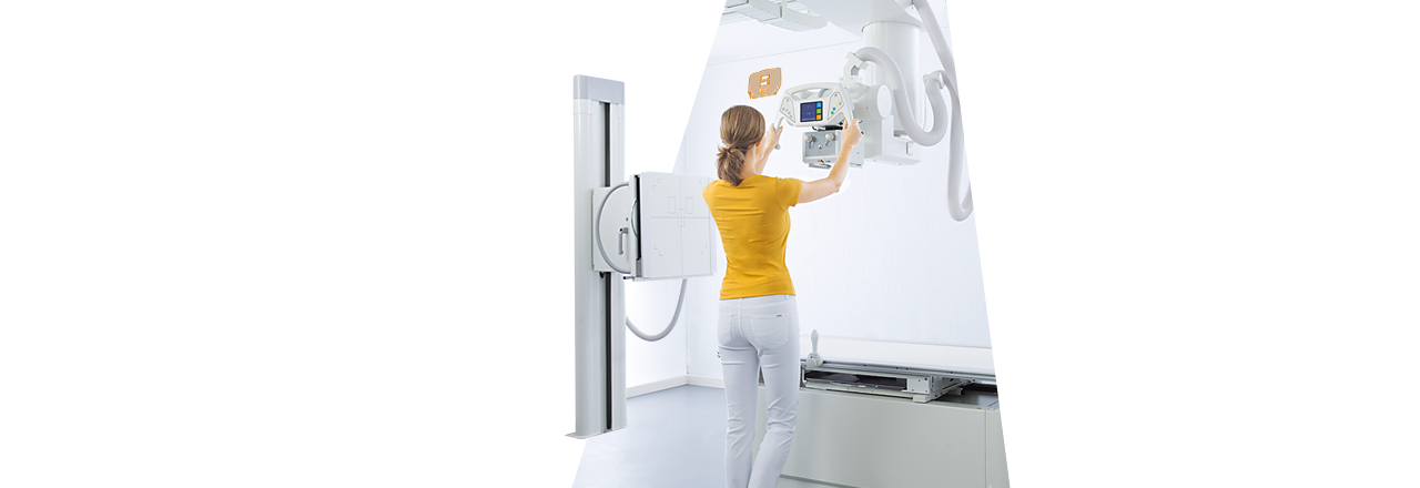 Ceiling-mounted X-ray system with patient positioning table and wall stand